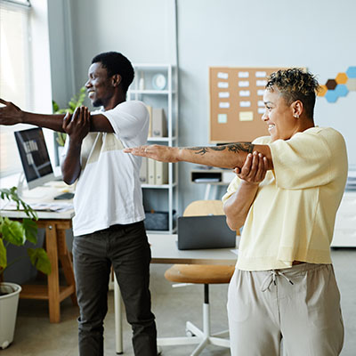 How to Stretch at Your Desk to Keep Yourself Limber - NetMGM